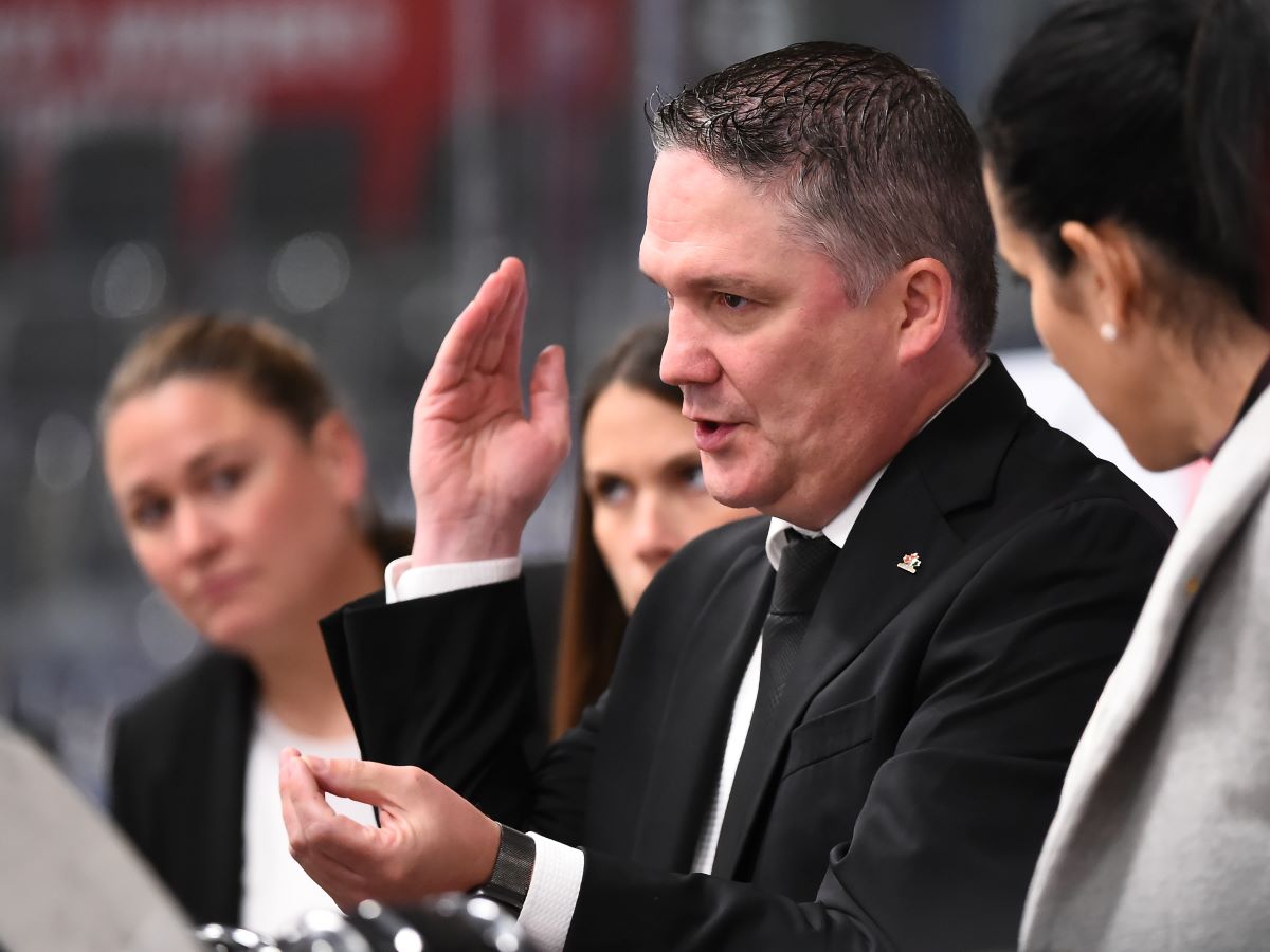 IIHF - Ryan Doubles Down Behind the Bench